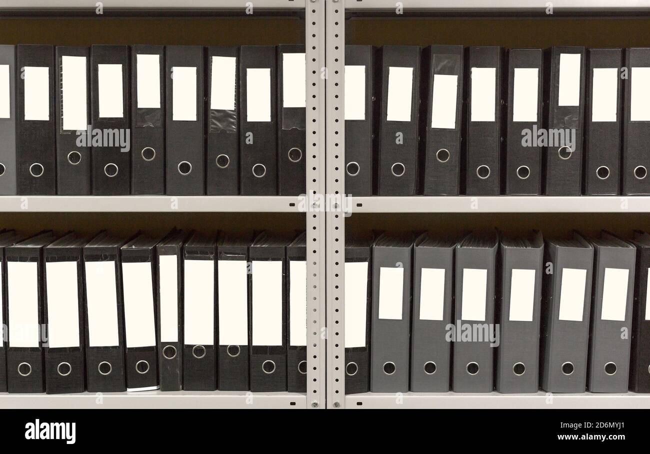 A lot of folders in the archive shelf: papers, documents and catalogs ...
