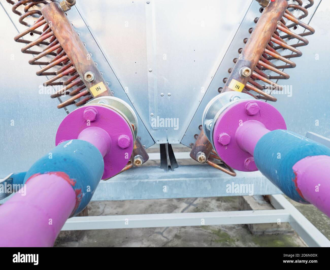 Industrial cooler unit on biomass powerplant. Pink and blue pipes ...