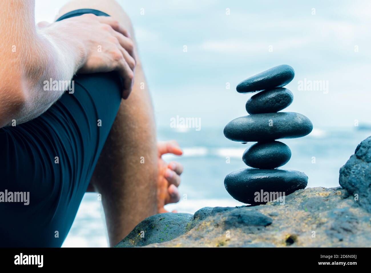 Balancing stones arranged in a pyramid shape Stock Photo - Alamy