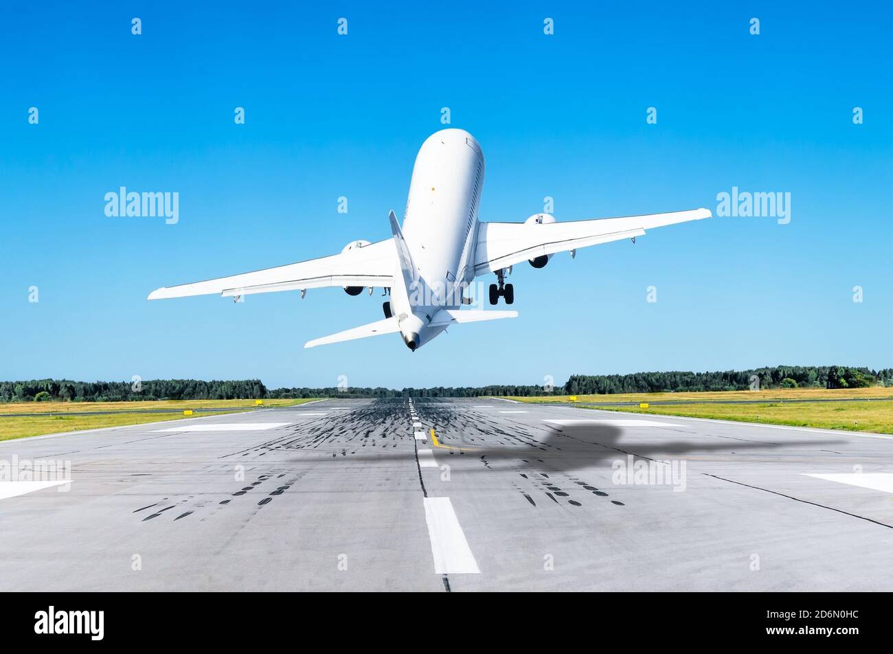 Passenger airplane takes off runway in the airport at a strong wind ...