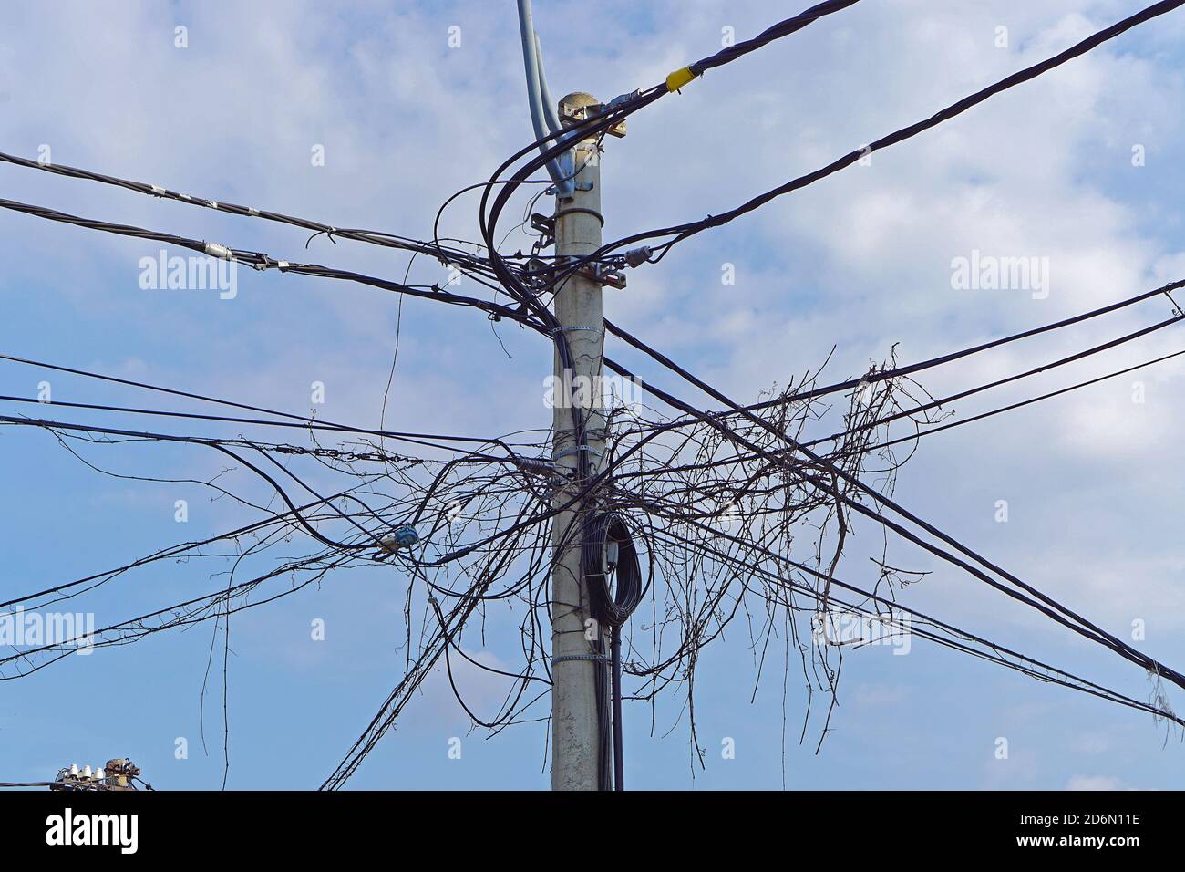 Utility pole with bunch of electric wires and cables mess Stock Photo ...