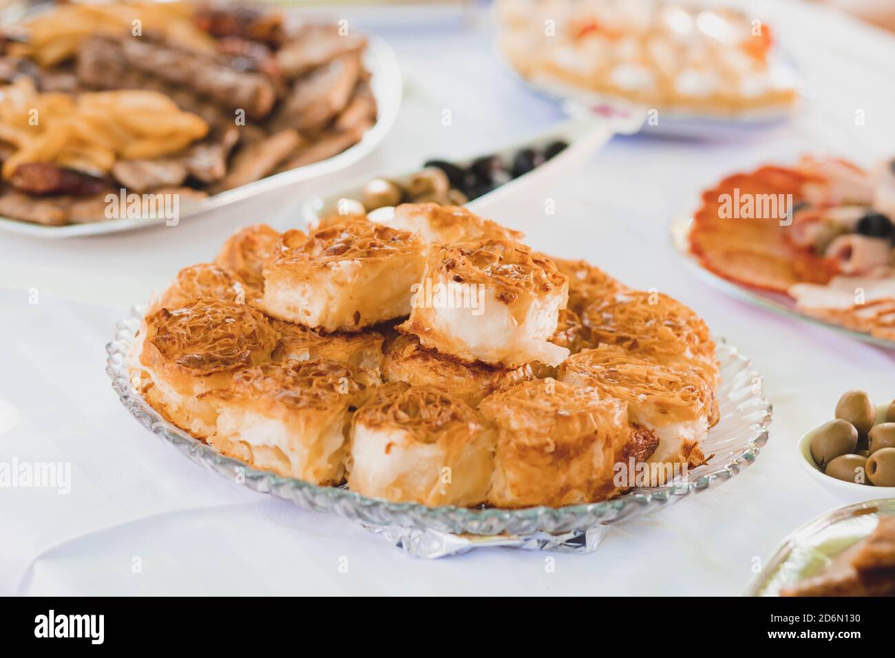 Pastry rolls on the table. Buffet, birthday reception Stock Photo - Alamy