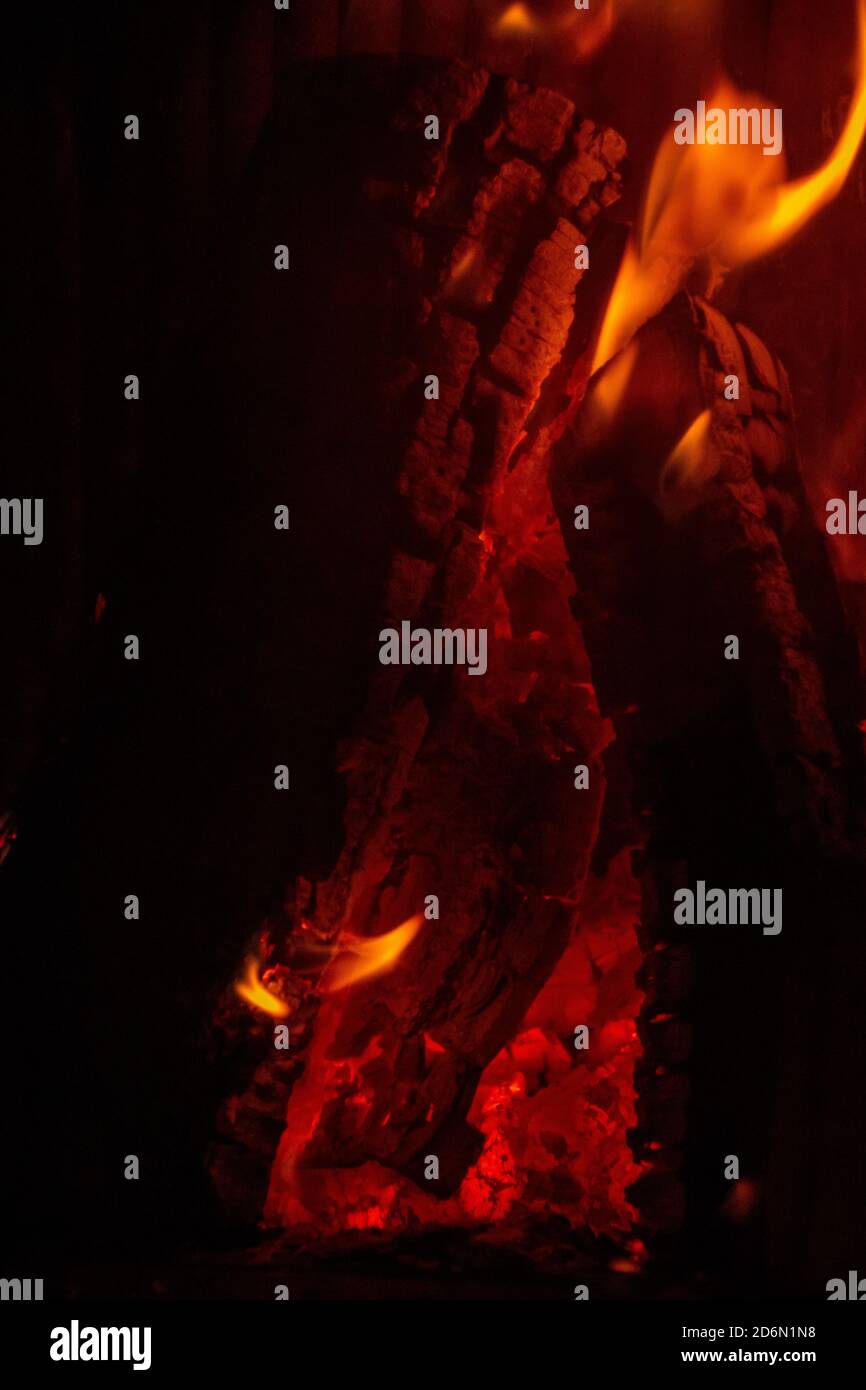Burning logs of a tree on an autumn evening Stock Photo - Alamy