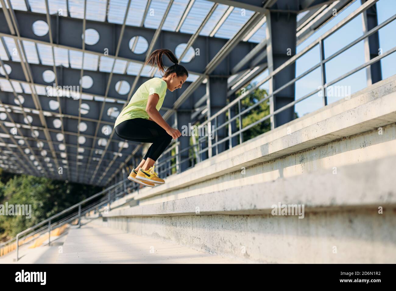 Squat jump woman hi-res stock photography and images - Alamy