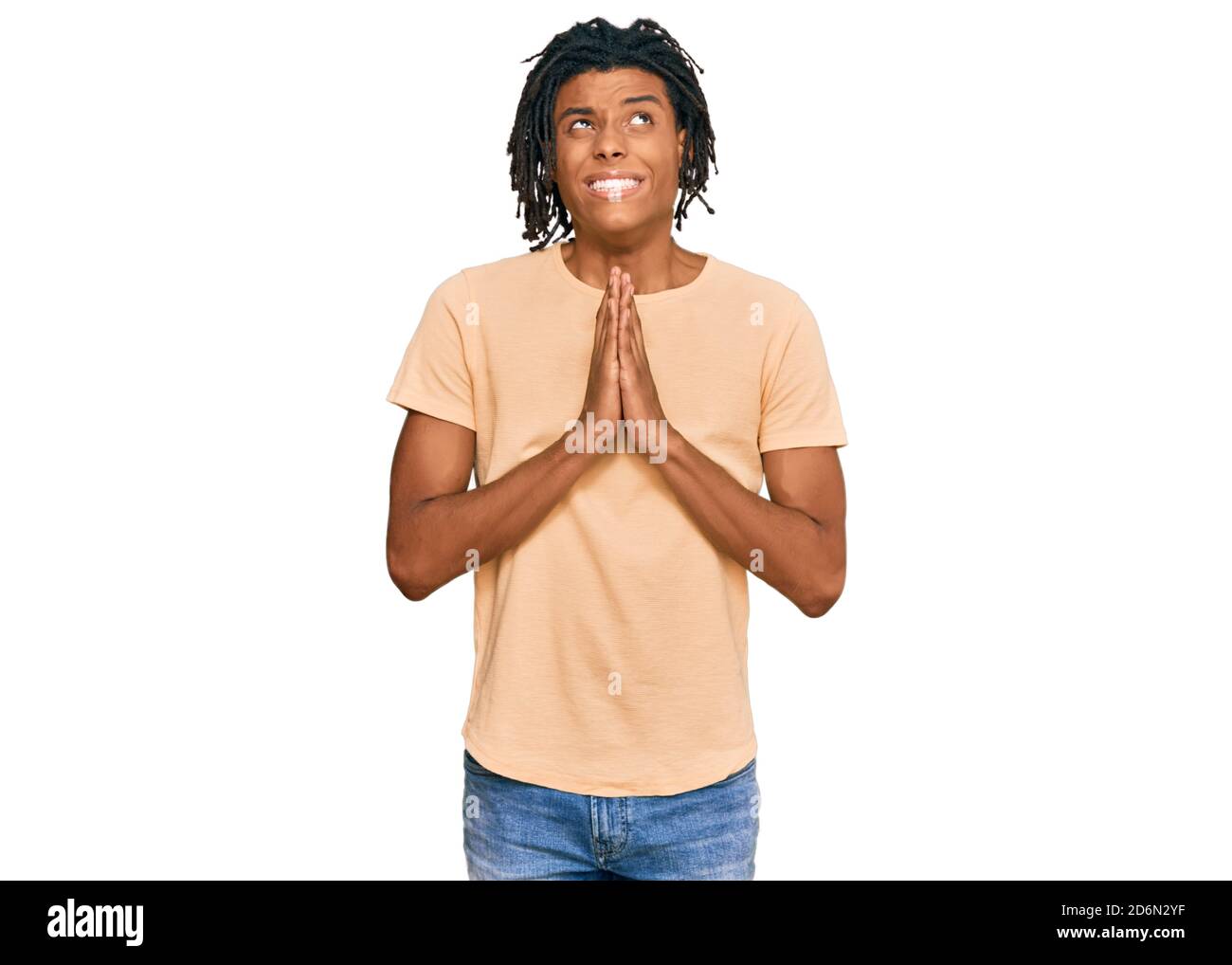Young african american man wearing casual clothes begging and praying ...