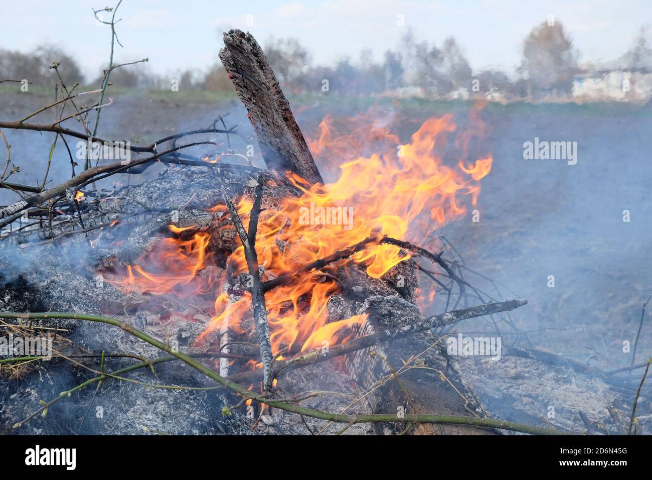 Big bonfire in the open air. A pile of ash from burnt boards and ...
