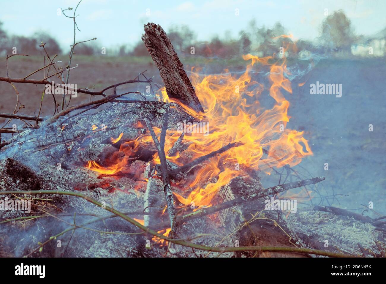 Big bonfire in the open air. A pile of ash from burnt boards and ...