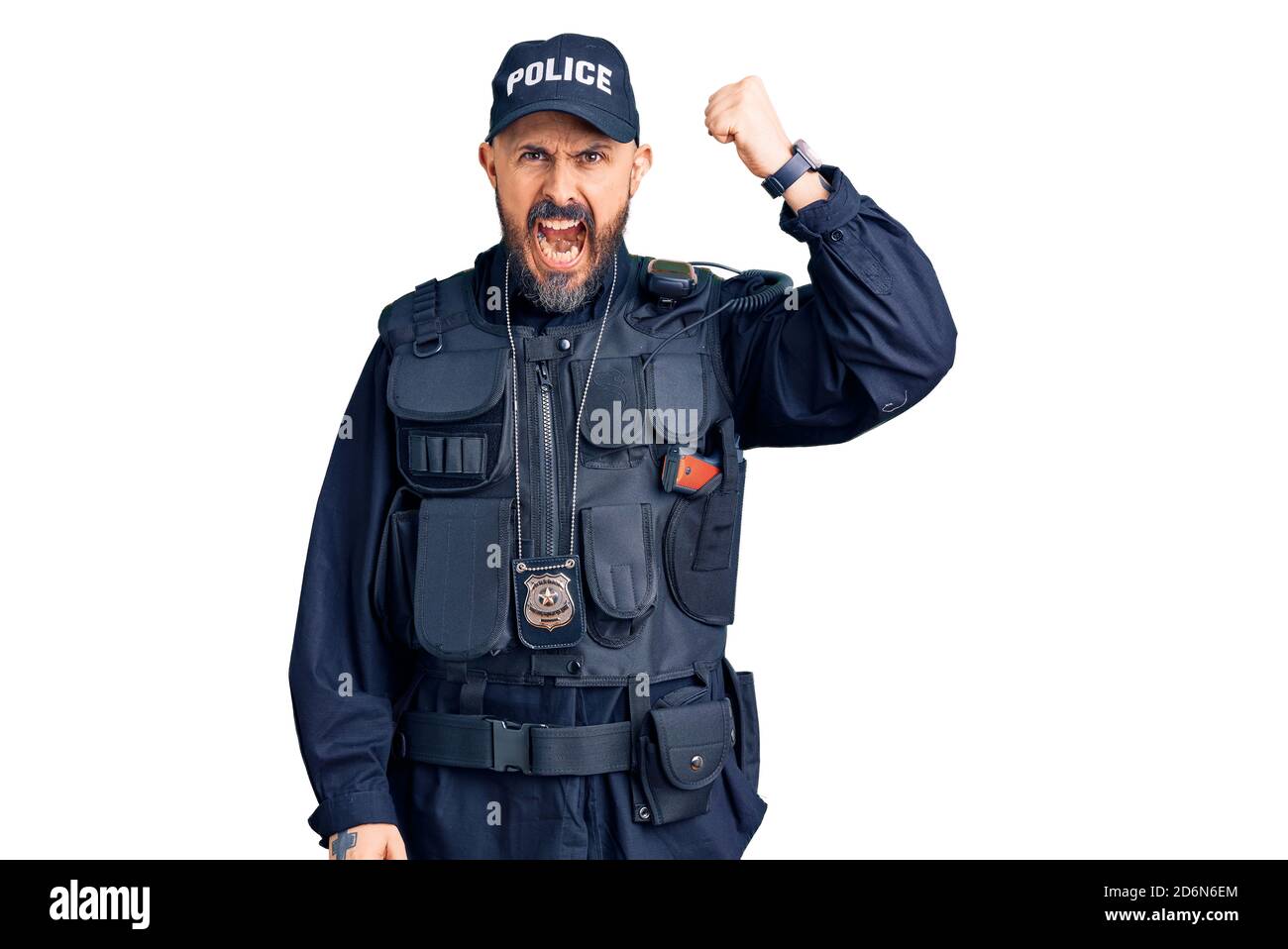 Young handsome man wearing police uniform angry and mad raising fist ...