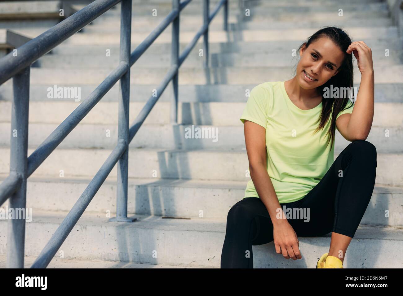 Beautiful lady resting between exercises on fresh air Stock Photo - Alamy