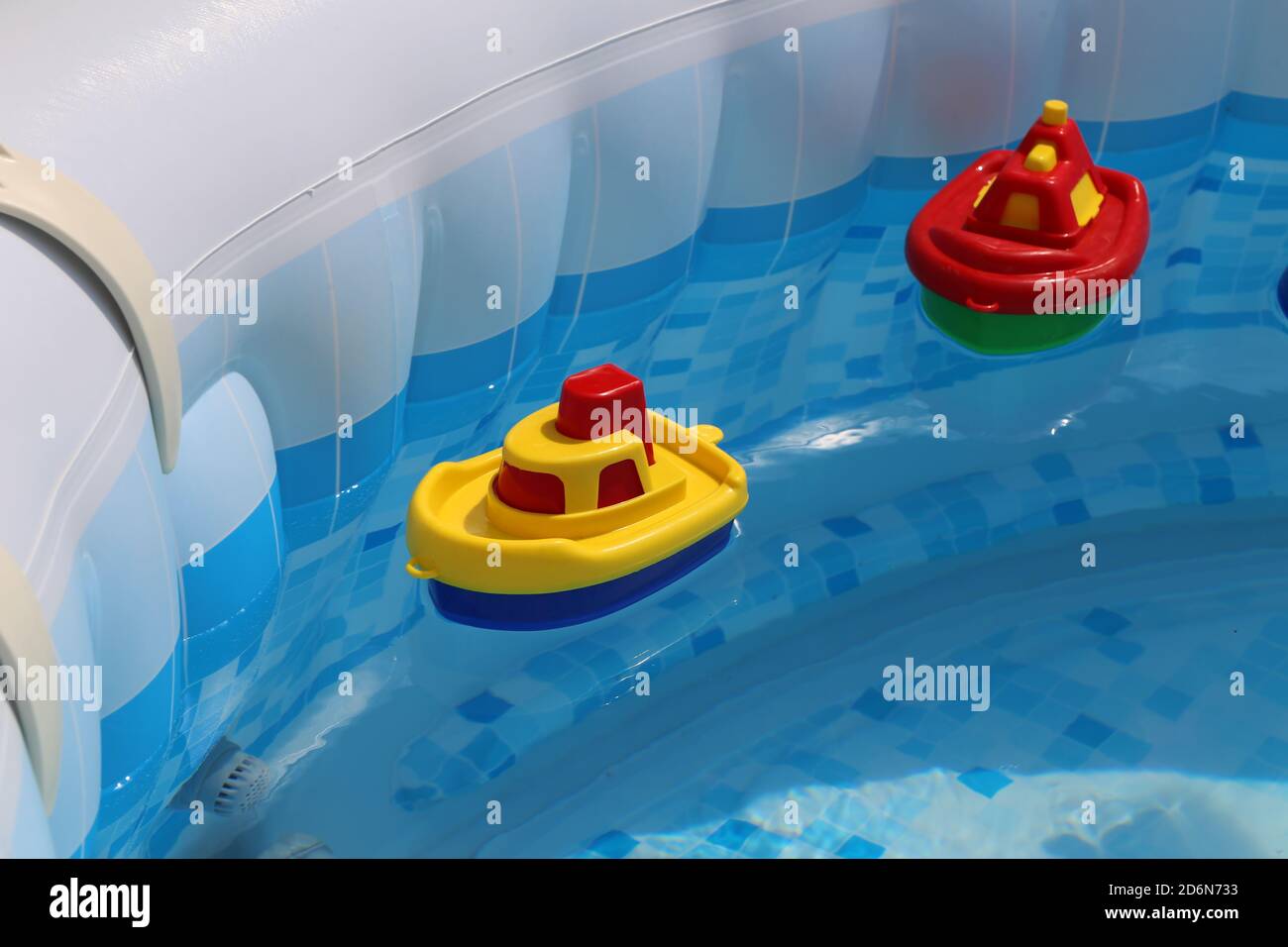Closeup high angle shot of toy boats floating in a kiddie pool Stock ...