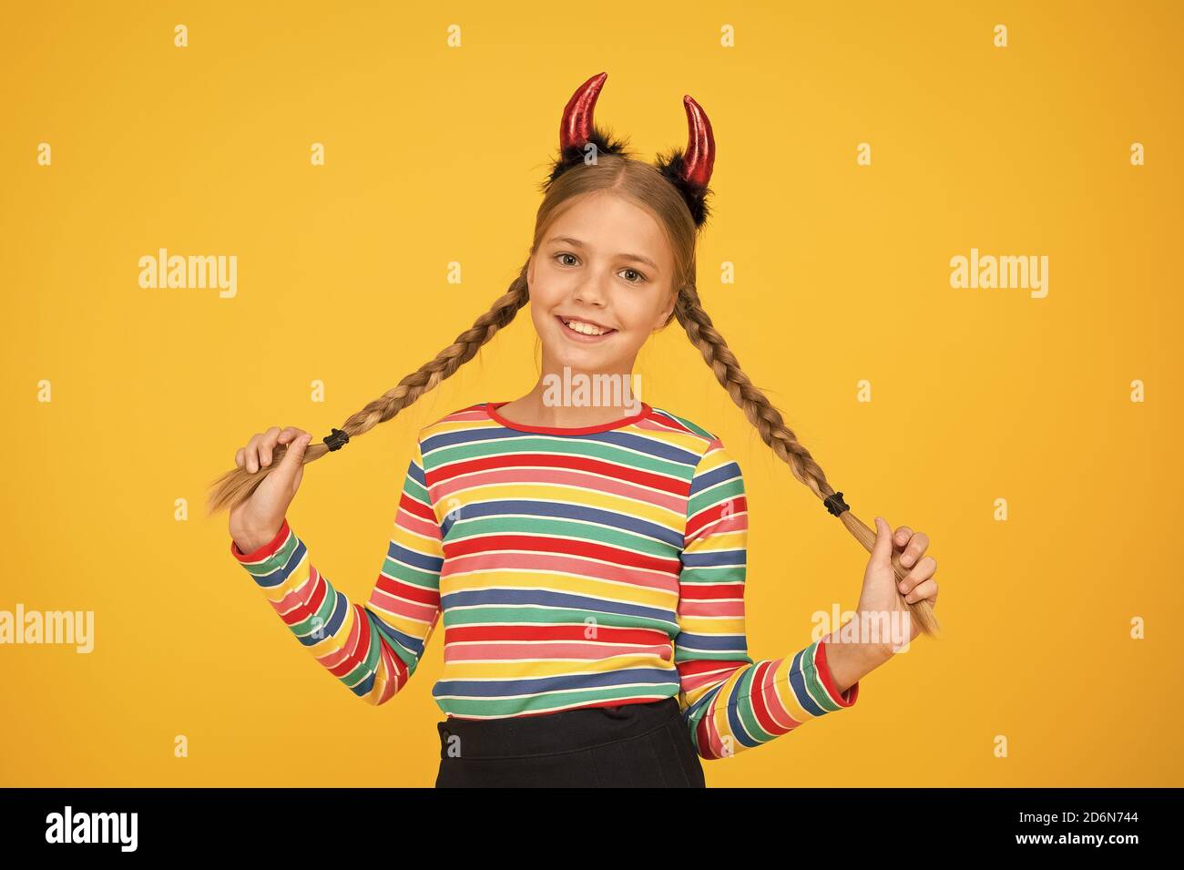 Easy holiday hairdo for long length hair. Halloween child hold long ...