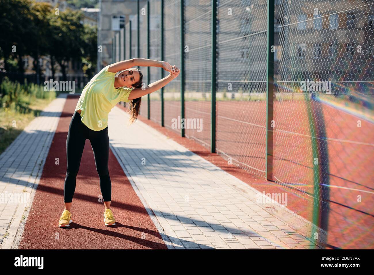 Female runner preparing for morning exercises on fresh air Stock Photo ...