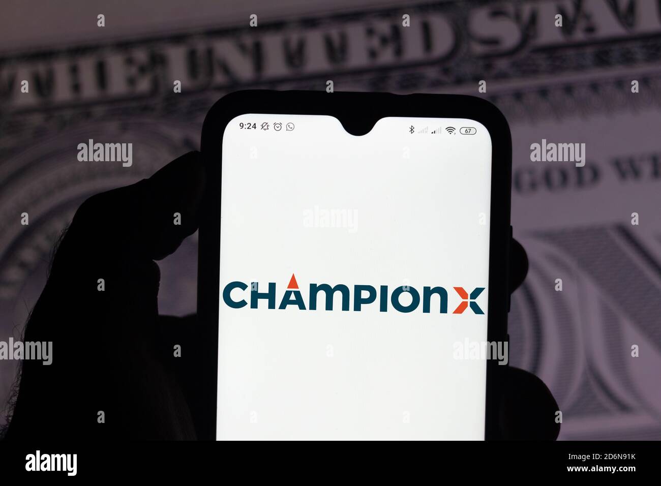 In this photo illustration the ChampionX logo seen displayed on a ...