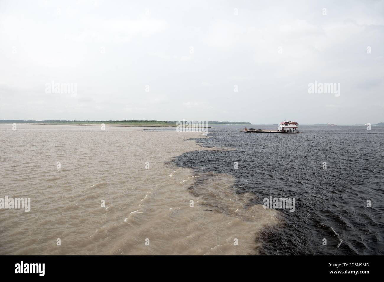 water meeting in brazil -amazon river with rio del negro. transfer boat ...