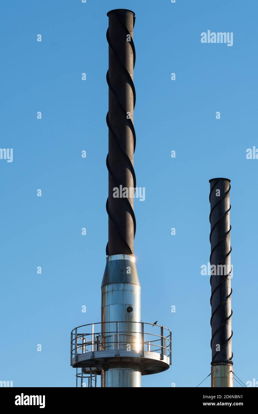 industrial chimney at a brewery against a blue sky background Stock ...