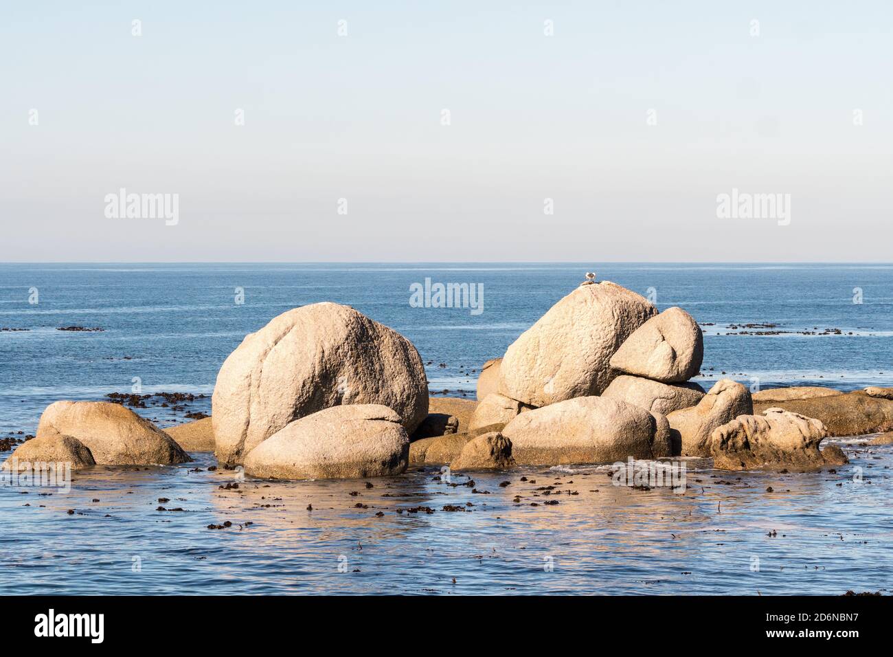granite boulders or rocks of various shapes and sizes in a calm or ...