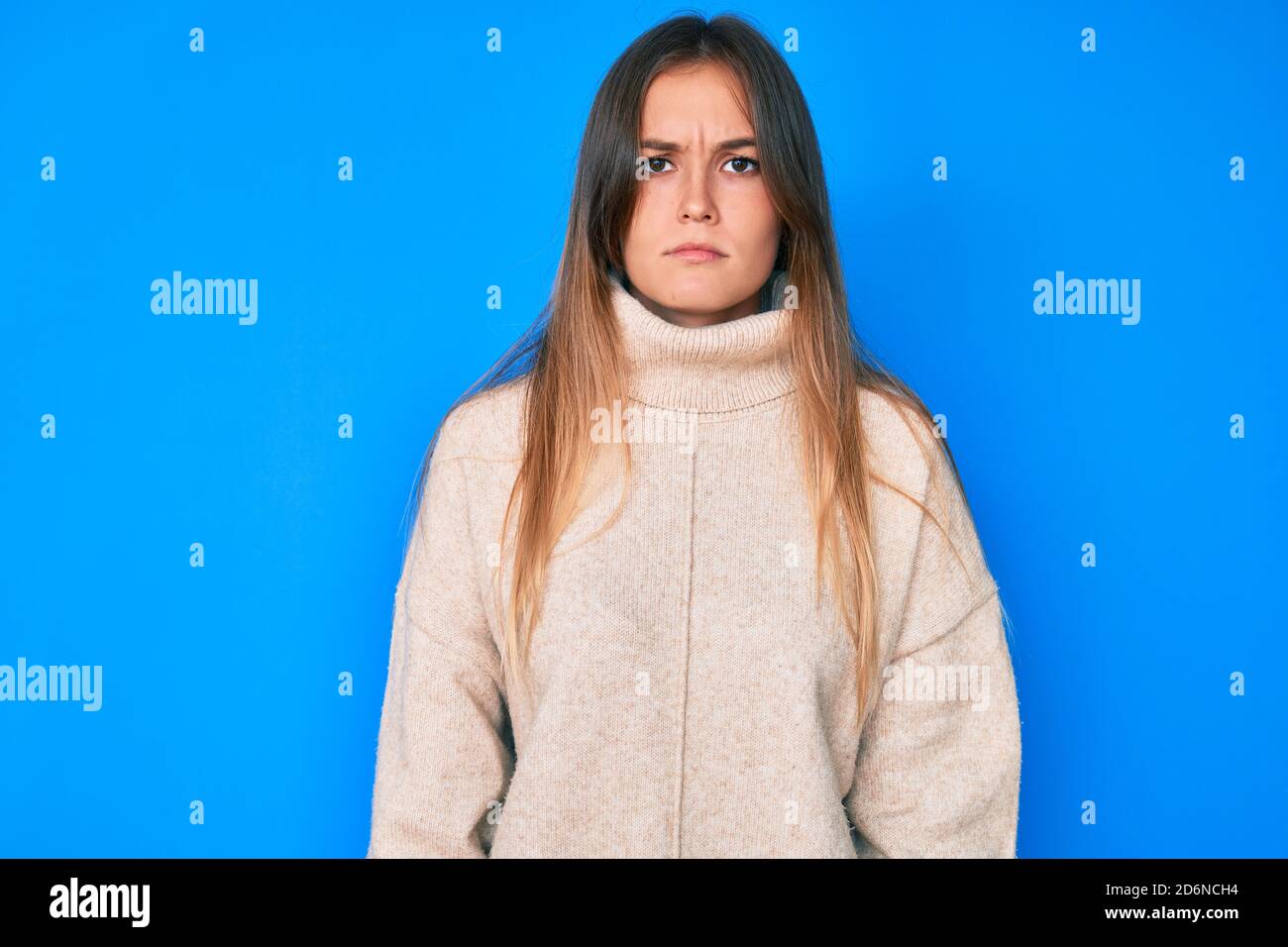 Beautiful caucasian woman wearing wool winter sweater depressed and ...