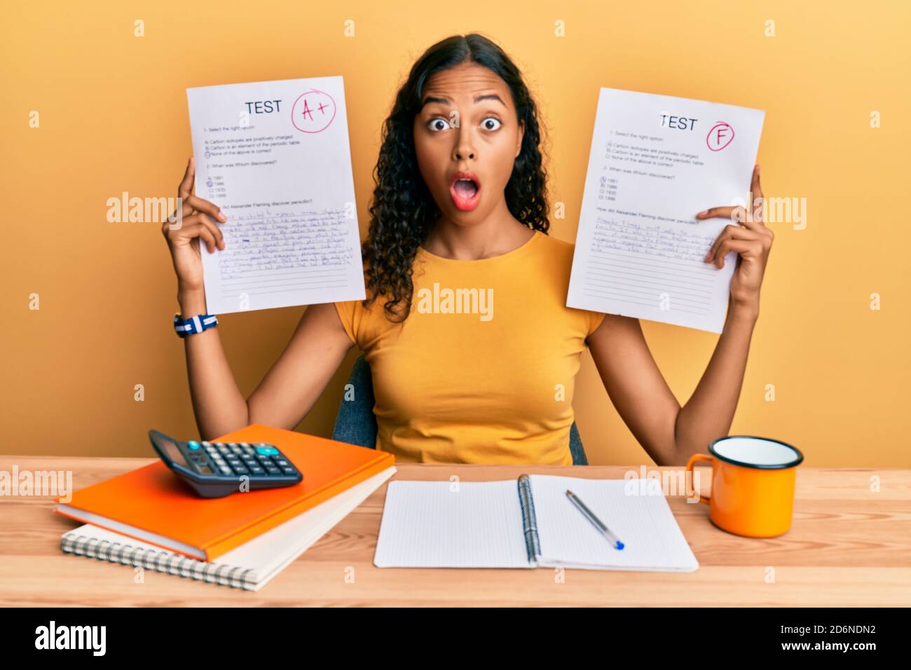 Young african american girl showing failed and passed exam afraid and ...