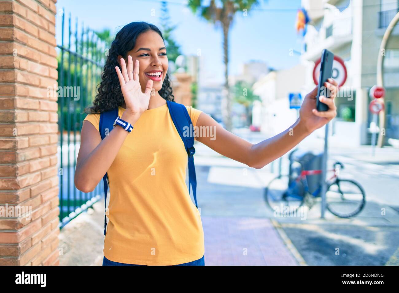 Young african american student girl doing video call using smartphone ...
