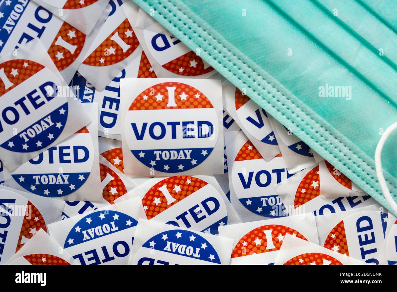 Top view of pile of Voting stickers and protective face mask. USA ...