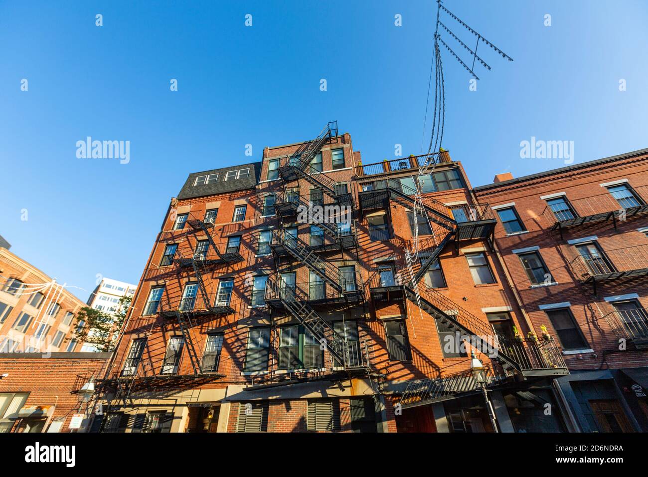 Italian quarter building with fire escape stairs hi-res stock ...