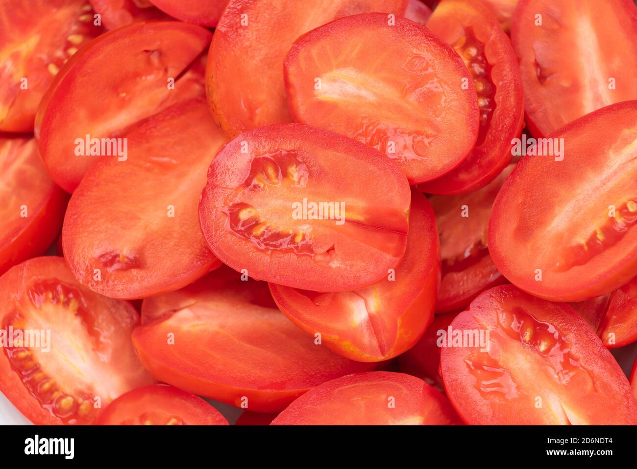 Tomatoes cut in half close up texture, tomatoes benefits Stock Photo ...