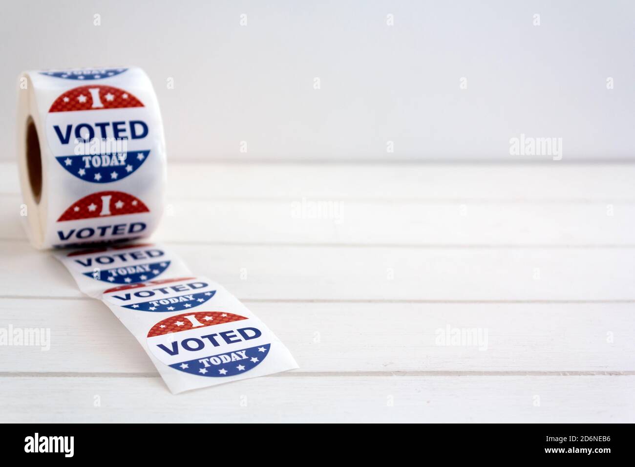 Roll of I Voted Today stickers on white wooden table with copy space ...