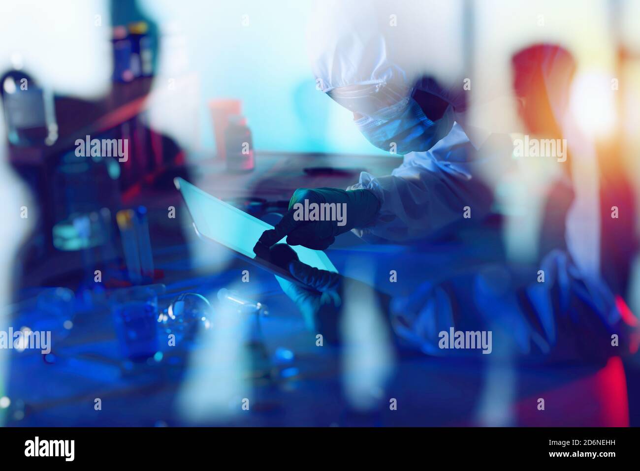 Man with tablet in a medical science laboratory. Concept of virus and ...