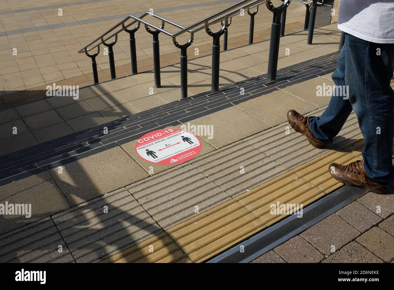 Durham, Uk, June 14th 2020, a person walking past COVID pavement ...