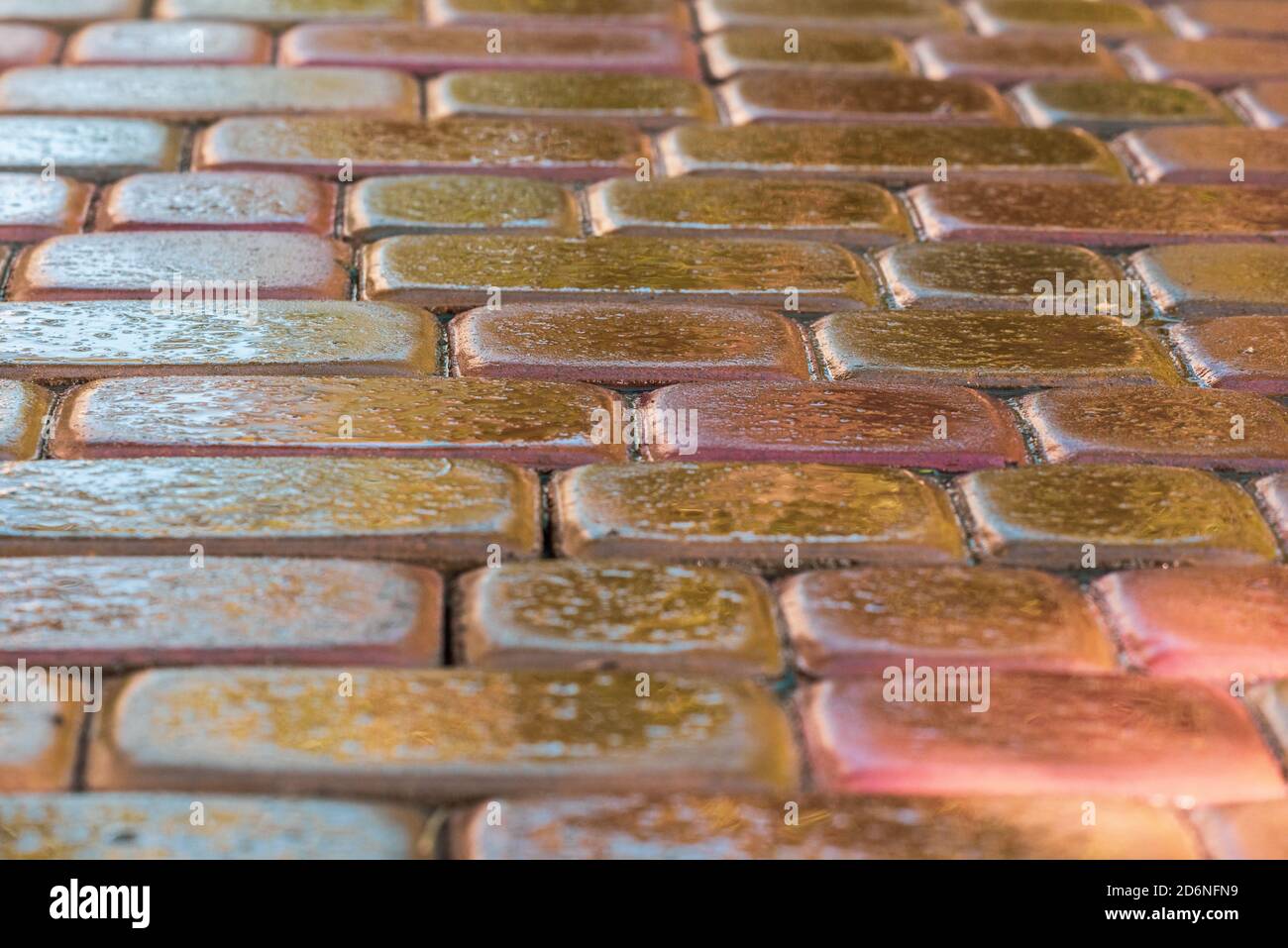pink paving slab after rain for background Stock Photo - Alamy