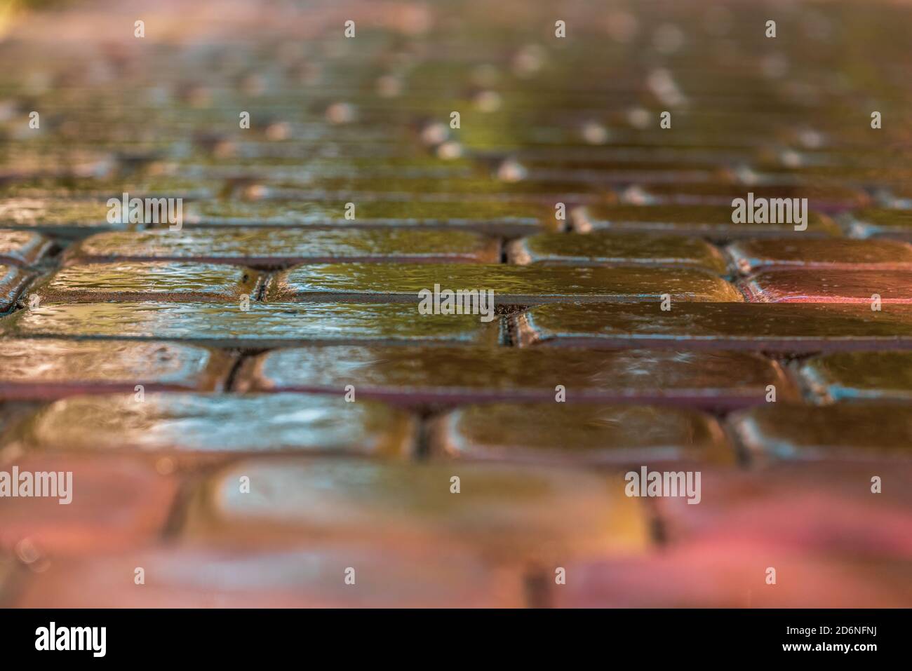 pink paving slab after rain for background Stock Photo - Alamy