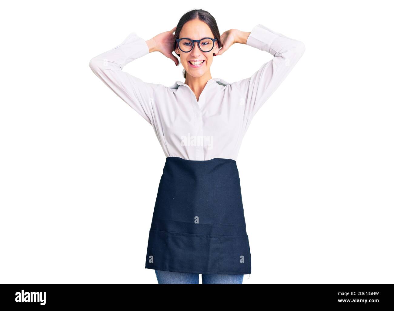 Beautiful brunette young woman wearing professional waitress apron ...