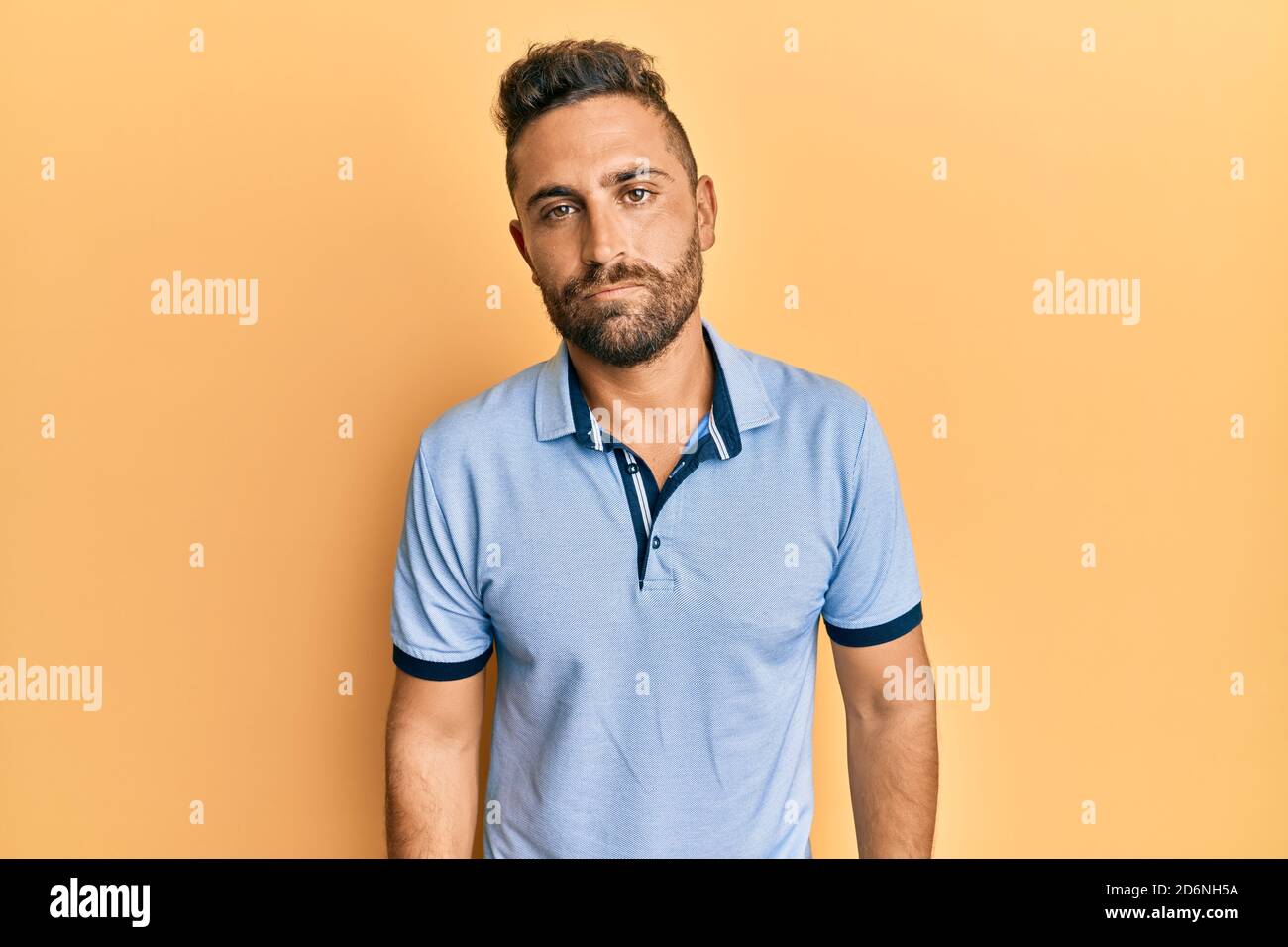 Handsome man with beard wearing casual clothes depressed and worry for ...