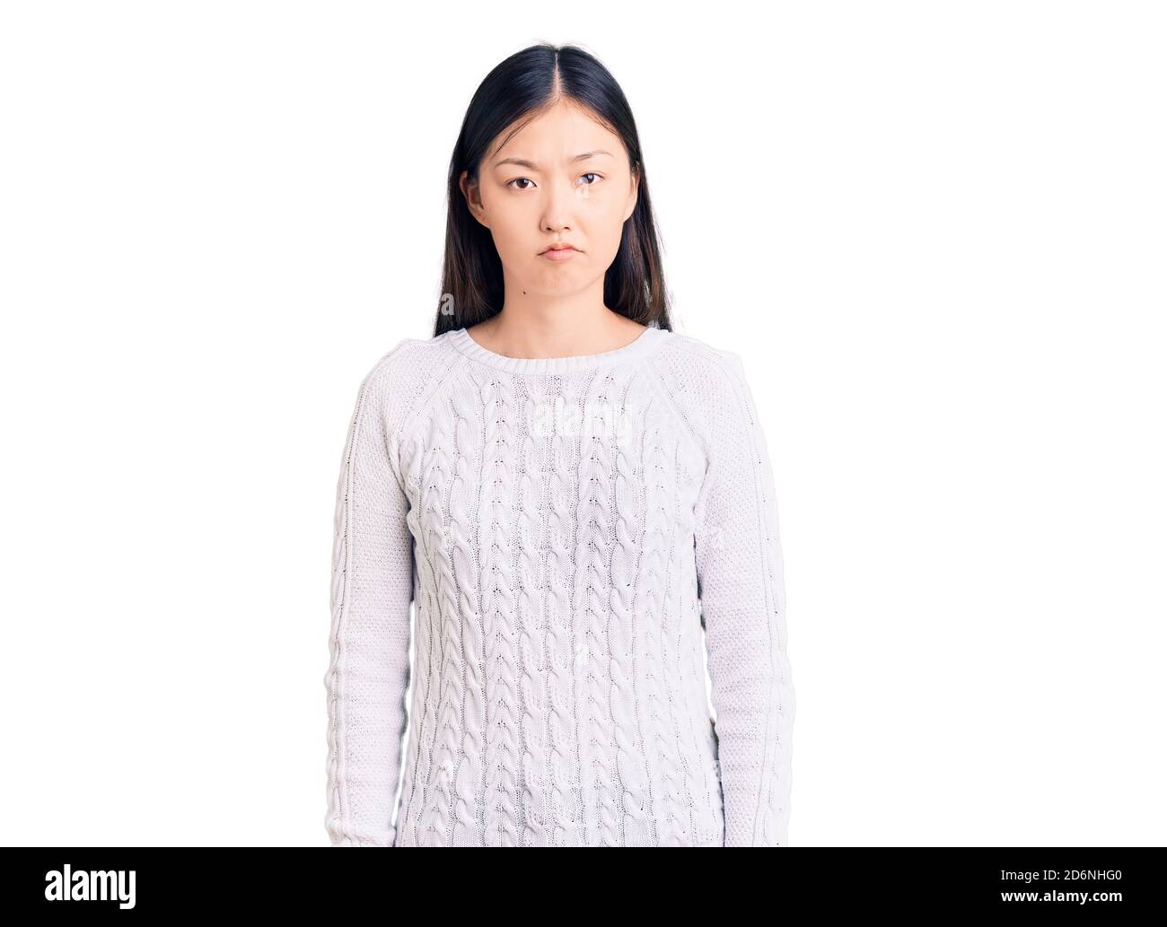 Young beautiful chinese woman wearing casual sweater depressed and ...