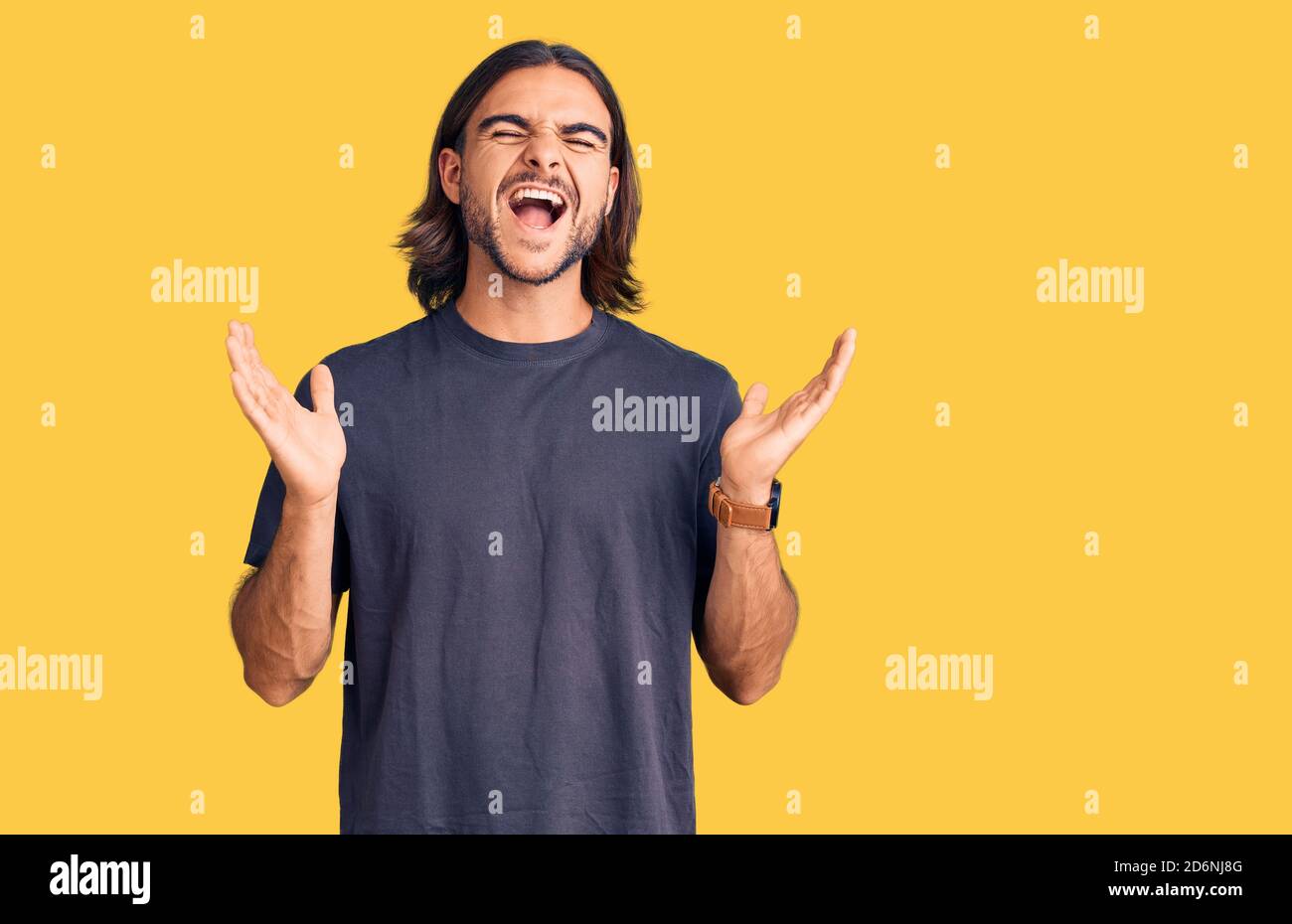 Young handsome man wearing casual clothes celebrating mad and crazy for ...