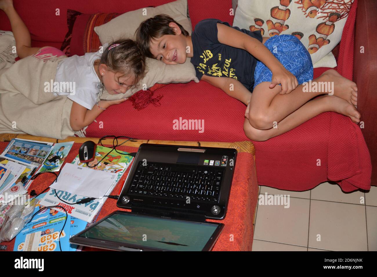Brother and sister in front of their PC Stock Photo - Alamy
