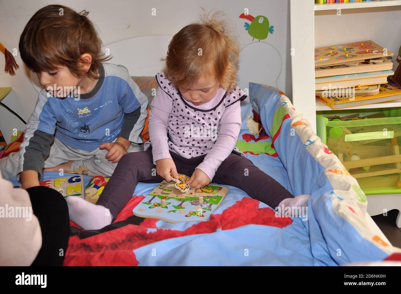 Brother and sister playing in their room Stock Photo - Alamy