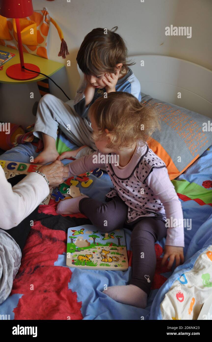 Brother and sister playing in their room Stock Photo - Alamy