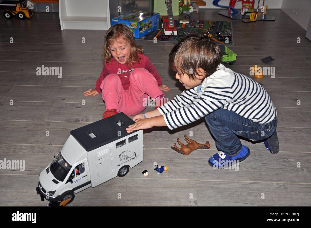 Brother and sister playing together in their room Stock Photo - Alamy