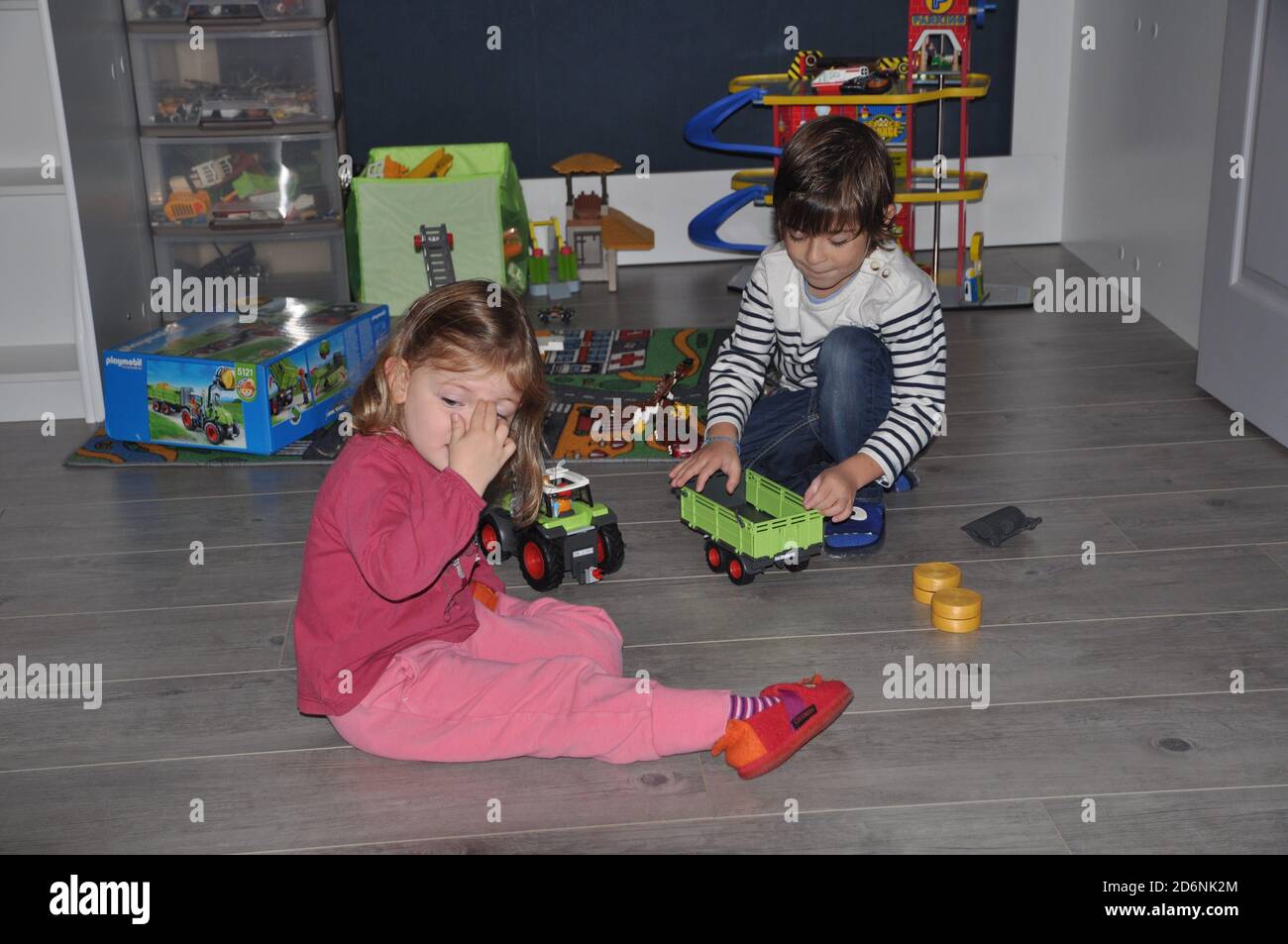 Brother and sister playing together in their room Stock Photo - Alamy