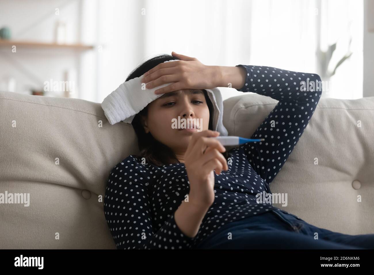 Sick young asian girl measure high temperature on thermometer Stock ...