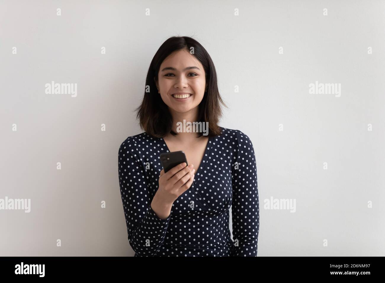 Portrait of happy Asian girl using smartphone Stock Photo - Alamy
