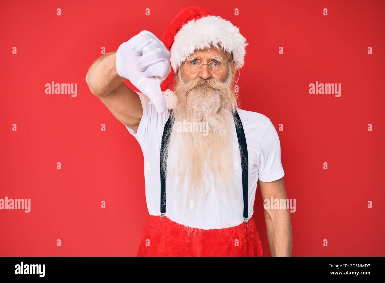 Old senior man with grey hair and long beard wearing white t-shirt and ...
