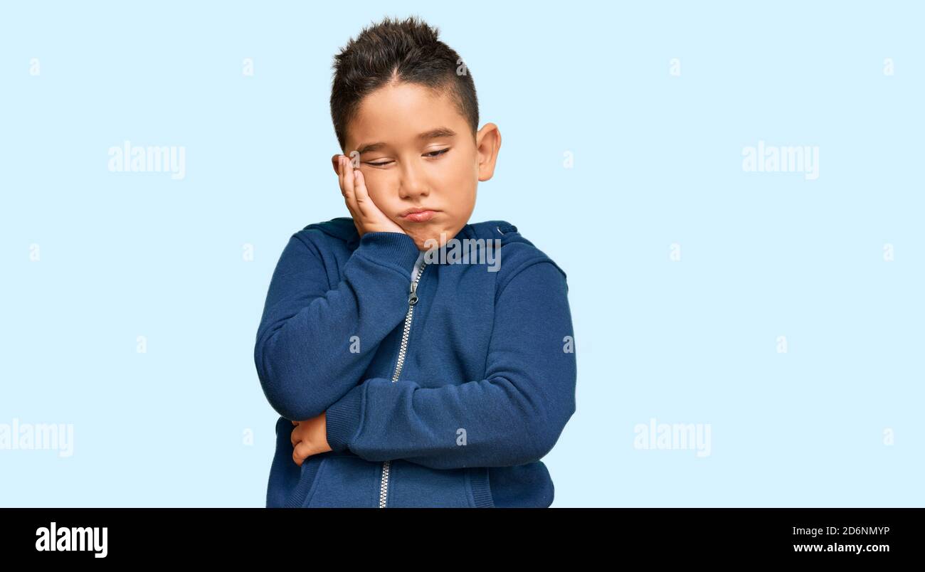 Little boy hispanic kid wearing casual sporty jacket thinking looking ...