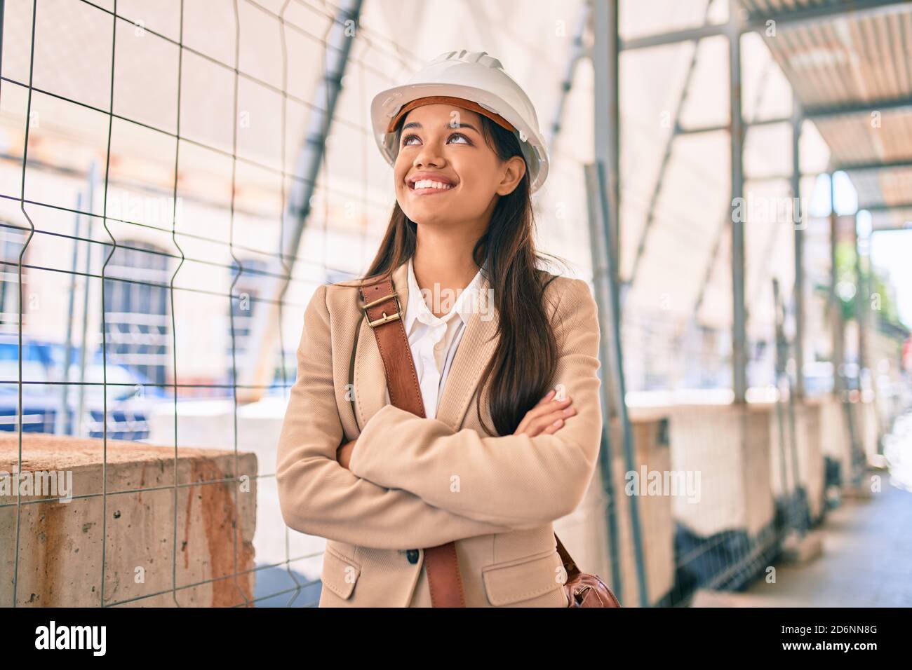 Young latin architect girl smiling happy standing at the city Stock ...