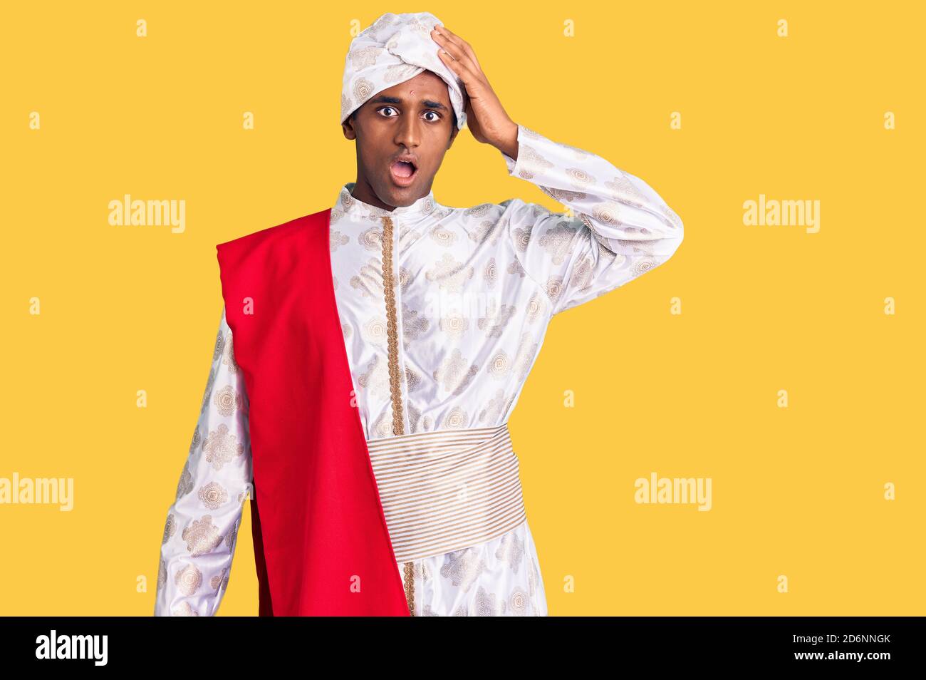 African handsome man wearing tradition sherwani saree clothes surprised ...