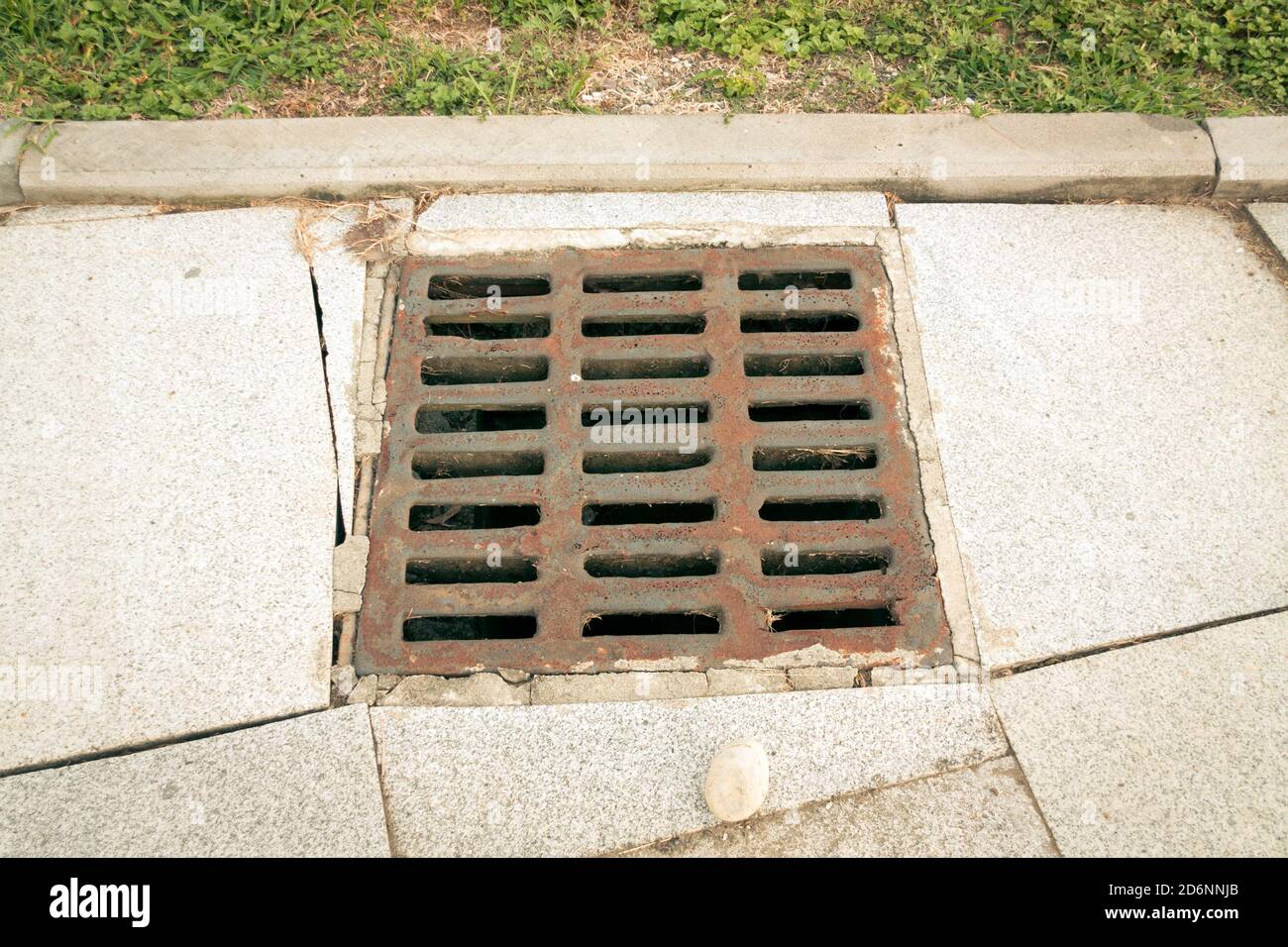 sewerage grid closeup in the city Stock Photo - Alamy