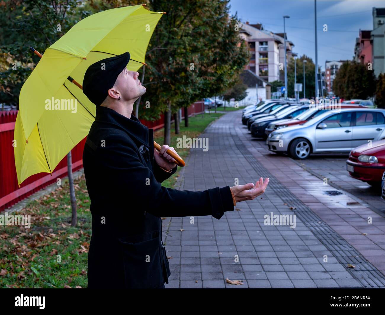 Checking if rain stopped hi-res stock photography and images - Alamy