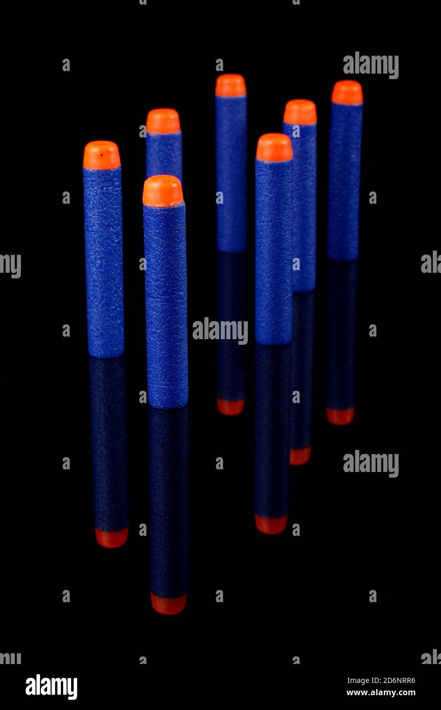 Toy gun bullets made from foam and rubber isolated on the black ...