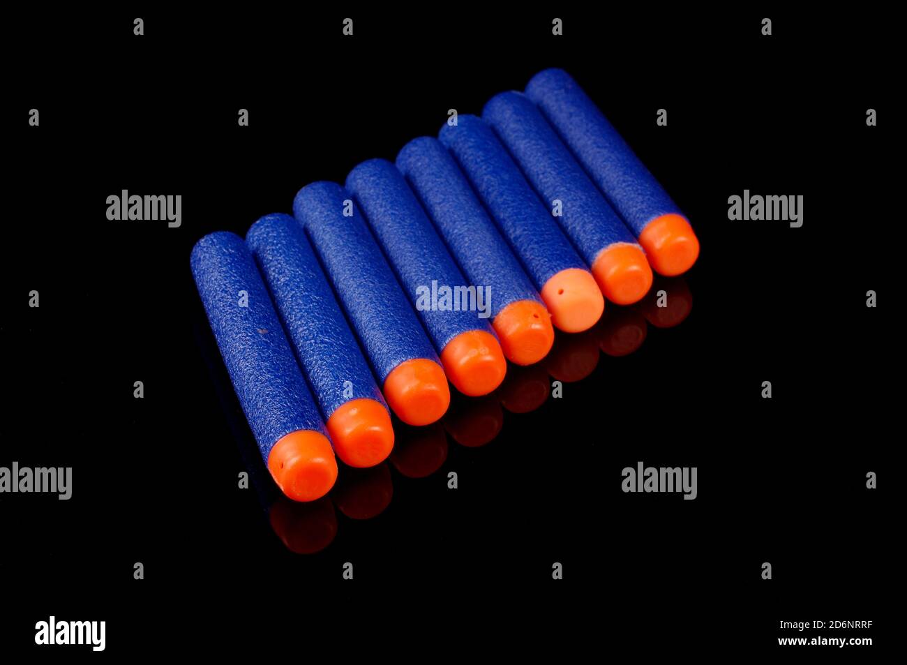 Toy gun bullets made from foam and rubber isolated on the black ...